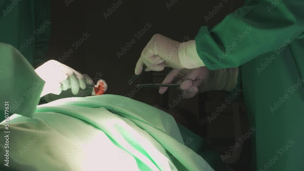 Group of team doctor and surgeon doing surgery with patient in the ...