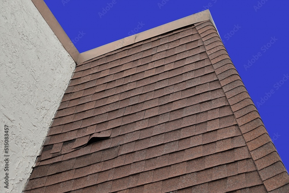 Shingles Lifting on Mansard Roof Stock Photo | Adobe Stock