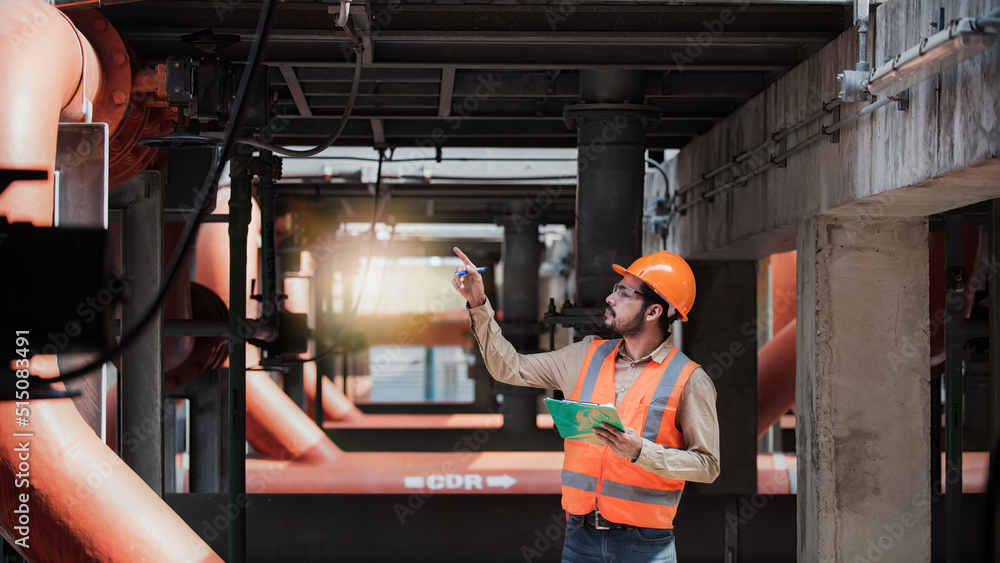 Engineer under checking the industry cooling tower air conditioner is ...