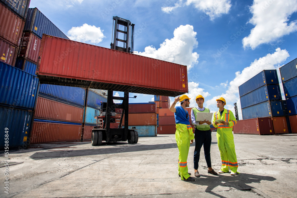 Group workers people in safety uniforms and hard hats work at logistics ...