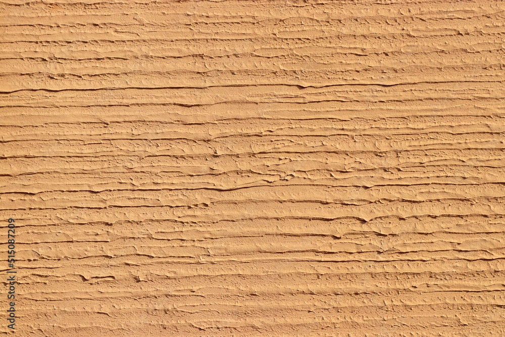 Dark beige earthen spray-painte architecture siding wall texture. Side ...