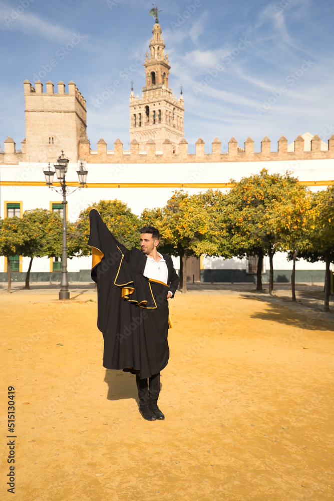 Young Spanish man in black shirt, jacket and pants, with dancing shoes ...