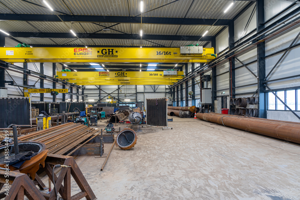 Interior of a steel factory with steel posts and beams and where ...