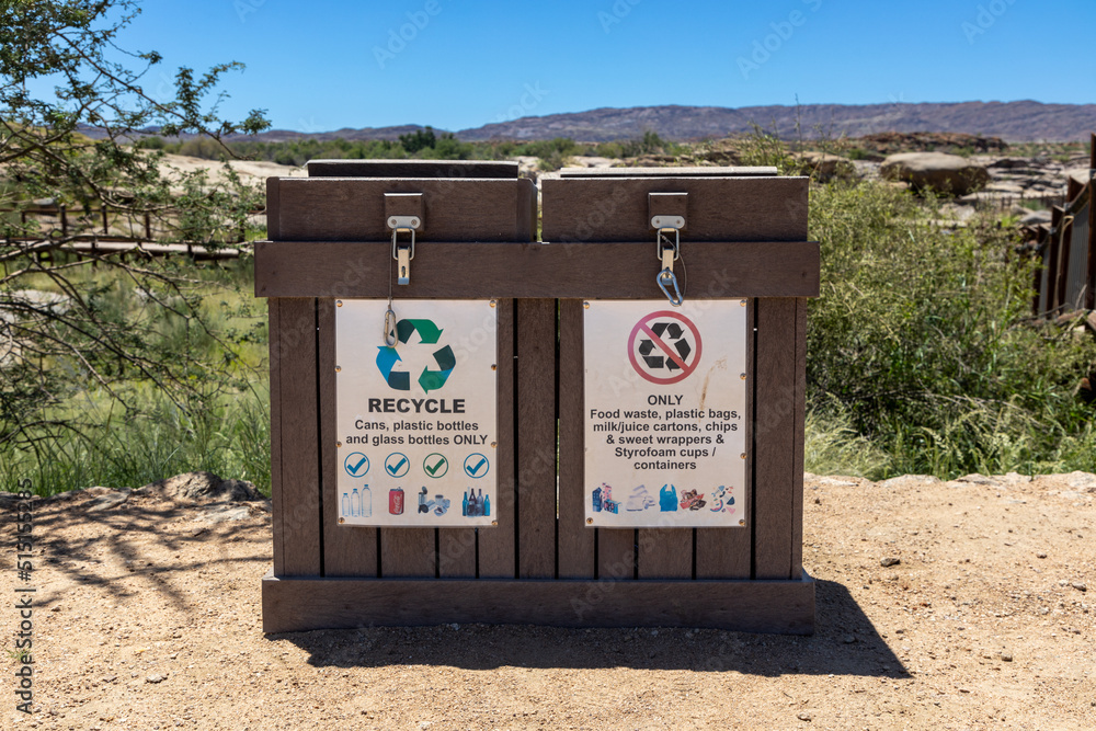 Recycle bin made of Plastic logs with recycle logos on it. Plastic ...