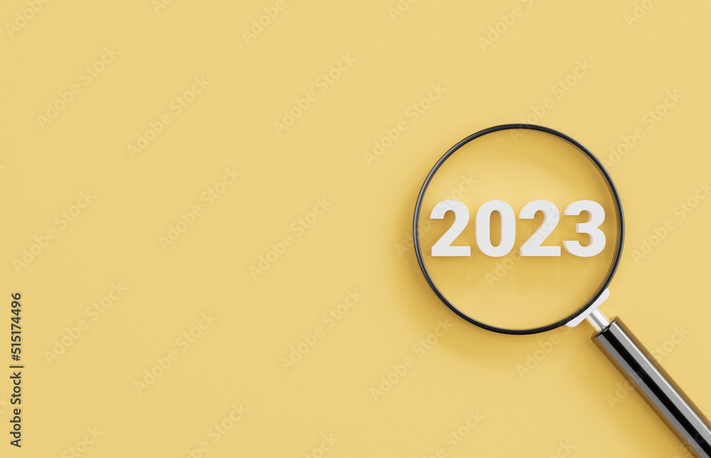 White number 2023 inside of magnifier glass on yellow background for ...