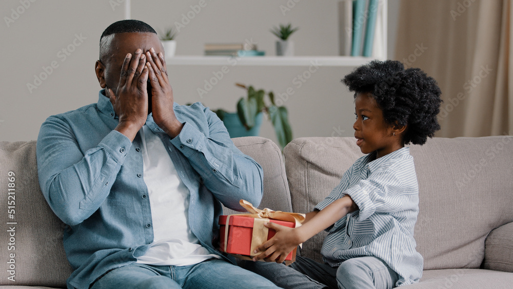 Little loving cute daughter congratulates dad on birthday gives gift ...
