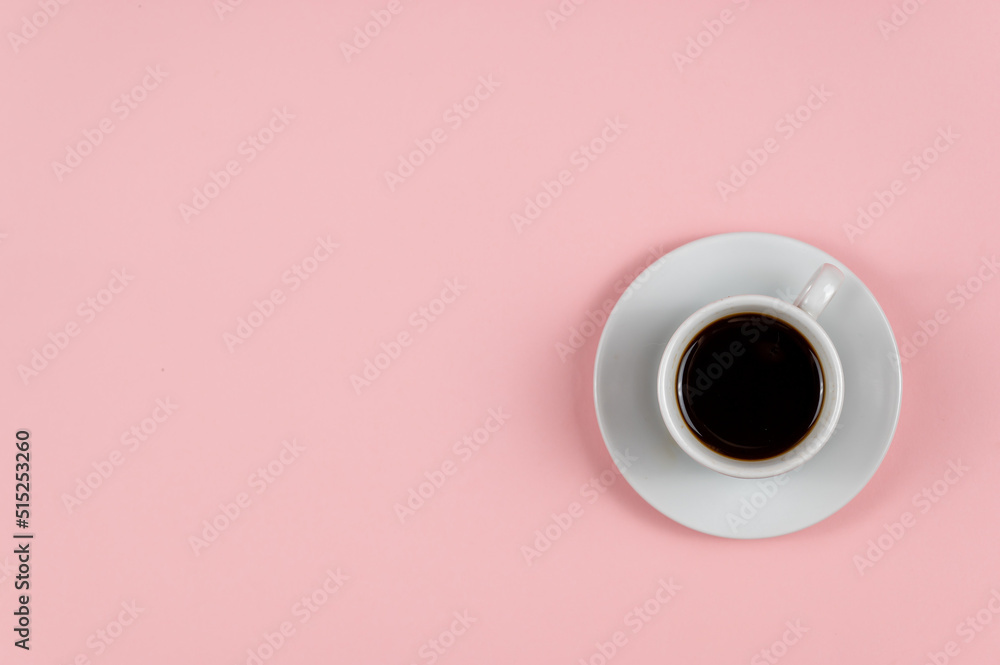 Espresso coffee against a pink background. White cup and saucer. Hot ...