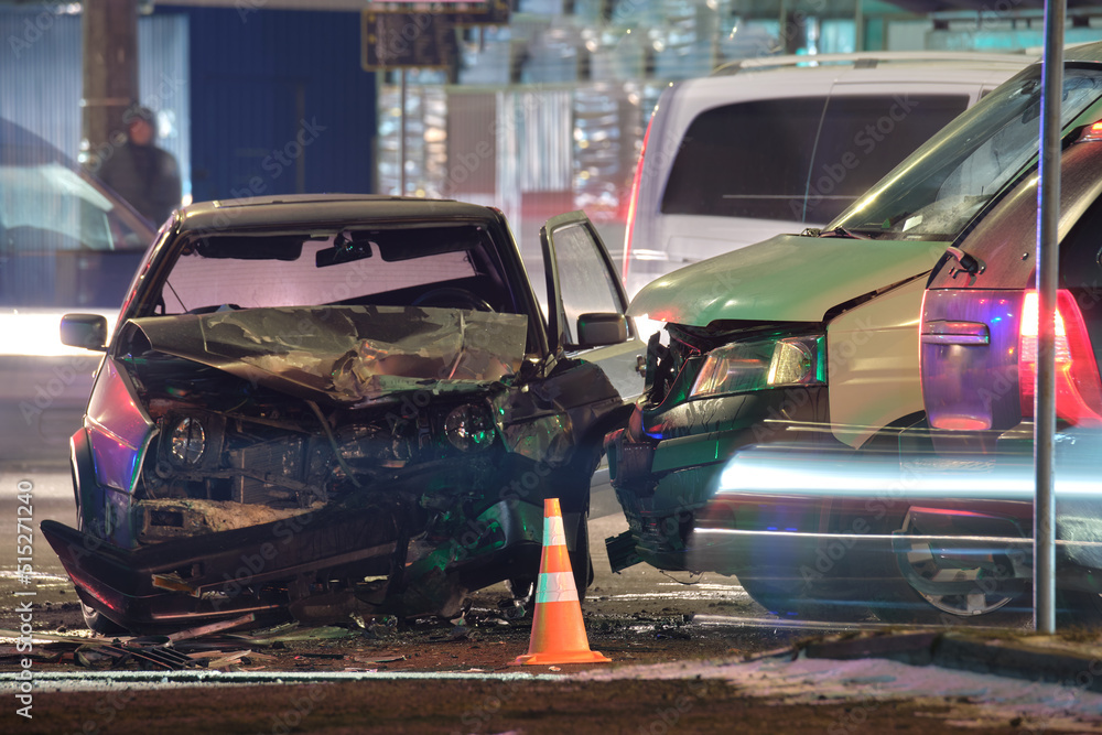 Damaged in heavy car accident vehicles after collision on city street ...