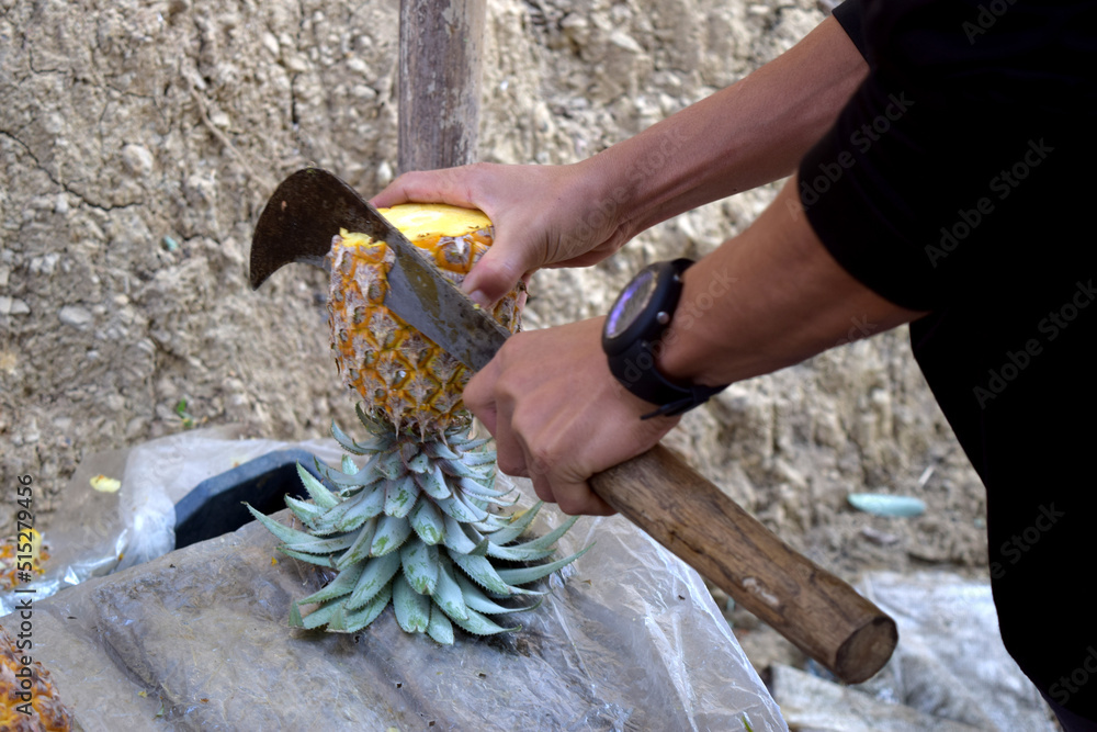 Cutting the pineapple with a sharp knife. Healthy Fruit for human ...