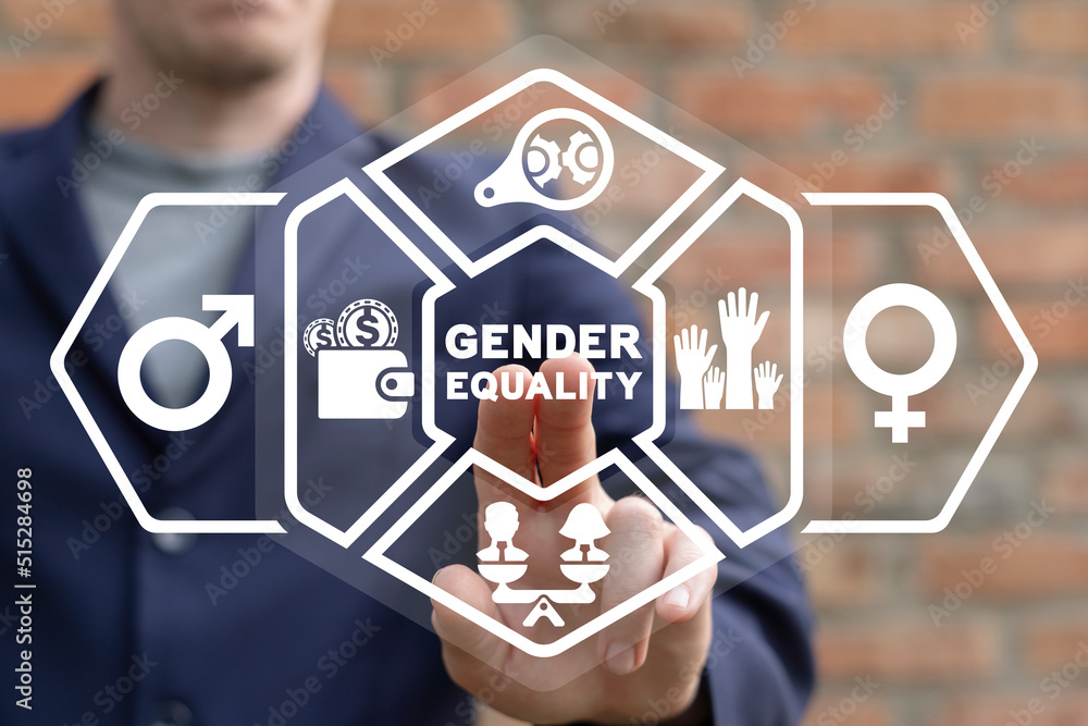 Concept of gender equality. Young man working on virtual touchscreen of future and presses ...