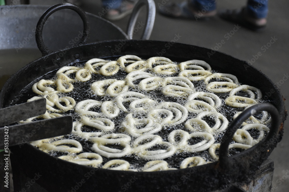 Making of Indian popular sweet dish Jalebi. Jalebi, also known as ...