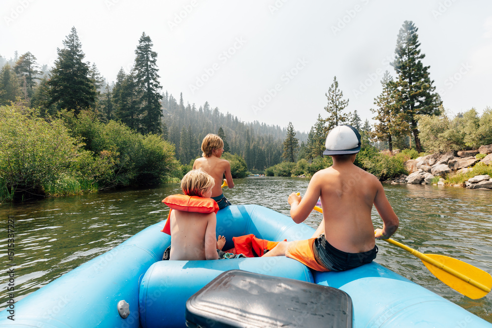Boys on inflatable boat Stock Photo | Adobe Stock