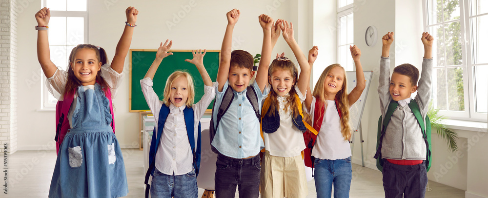 Small team of children having fun at school. Group portrait of happy ...