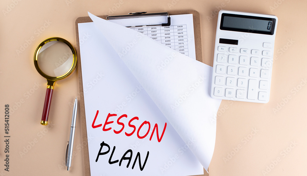 Clipboard with chart and text LESSON PLAN with magnifier ,calculator on ...
