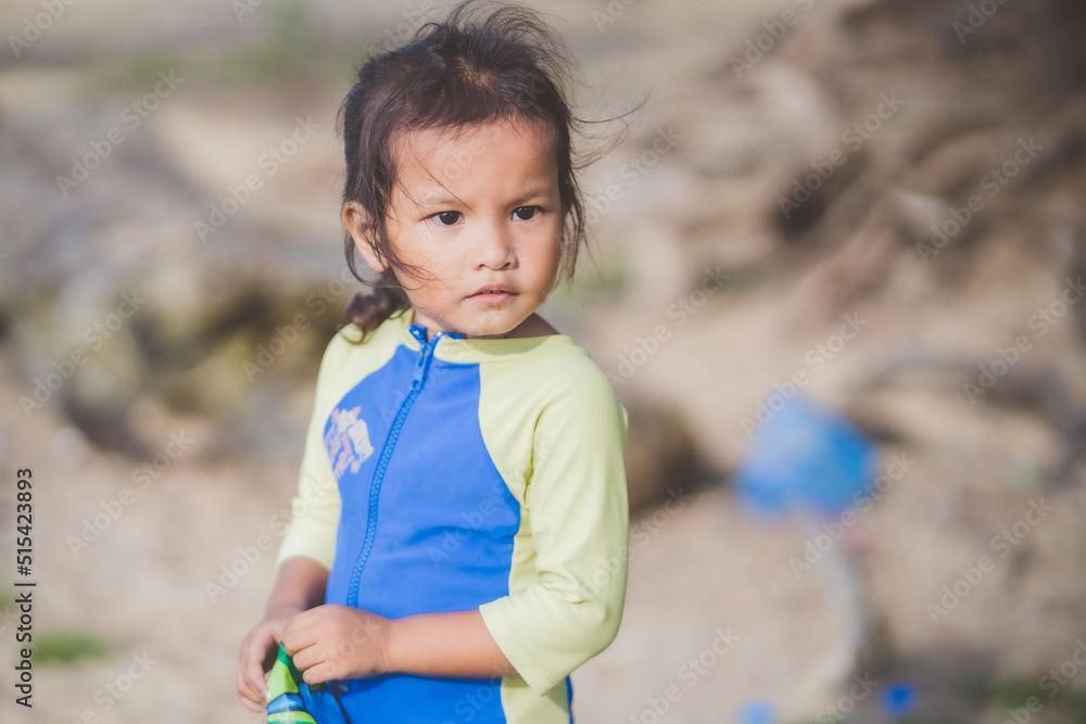 girl eating in bathing suit at sea Stock Photo | Adobe Stock