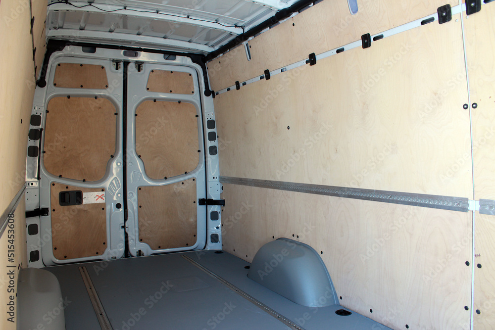 Trunk of a modern cargo van. Interior of a modern cargo van. Cargo van ...