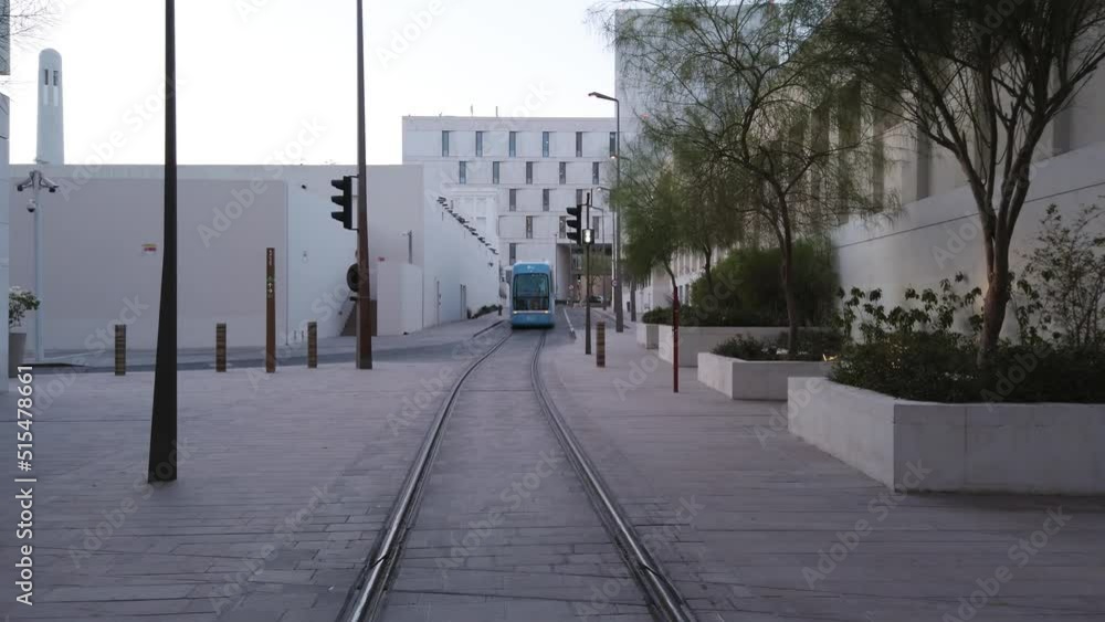 Public transportation tram in modern architecture of Msheireb Downtown ...
