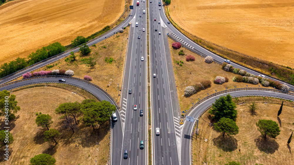 Motorway interchange in Italy. Each carriageway with three lanes of ...