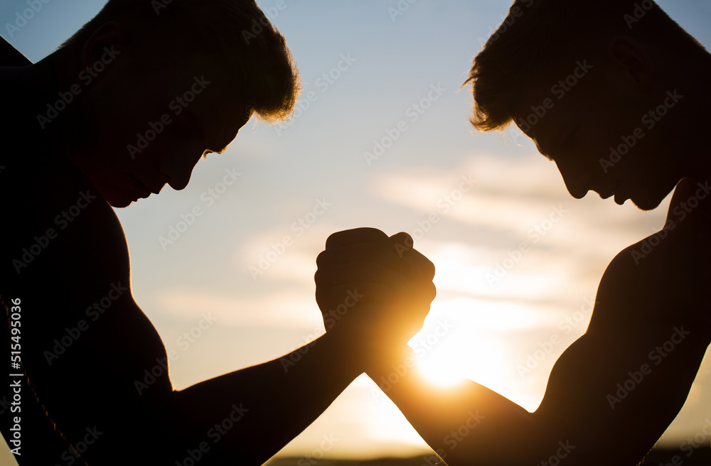 Rivalry, vs, challenge, hand wrestling. Sunset, sunrise. Rivalry ...