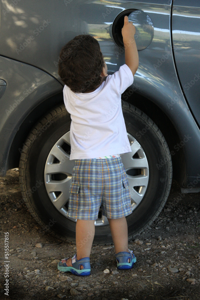 Little boy doing mischief. Baby investigating the world. Child learning ...