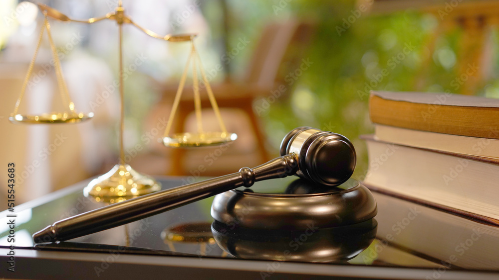 Lawyer or judge's hammer in the court. Auction's hammer is on woo table ...