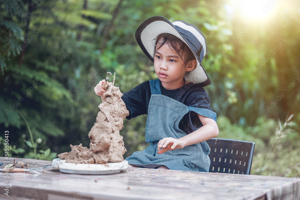 Child girl doing model clay at the art lesson. Preschool. Concepts of ...