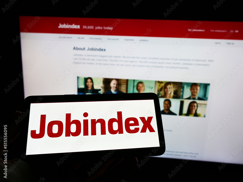 Stuttgart, Germany - 07-03-2022: Person holding mobile phone with logo ...