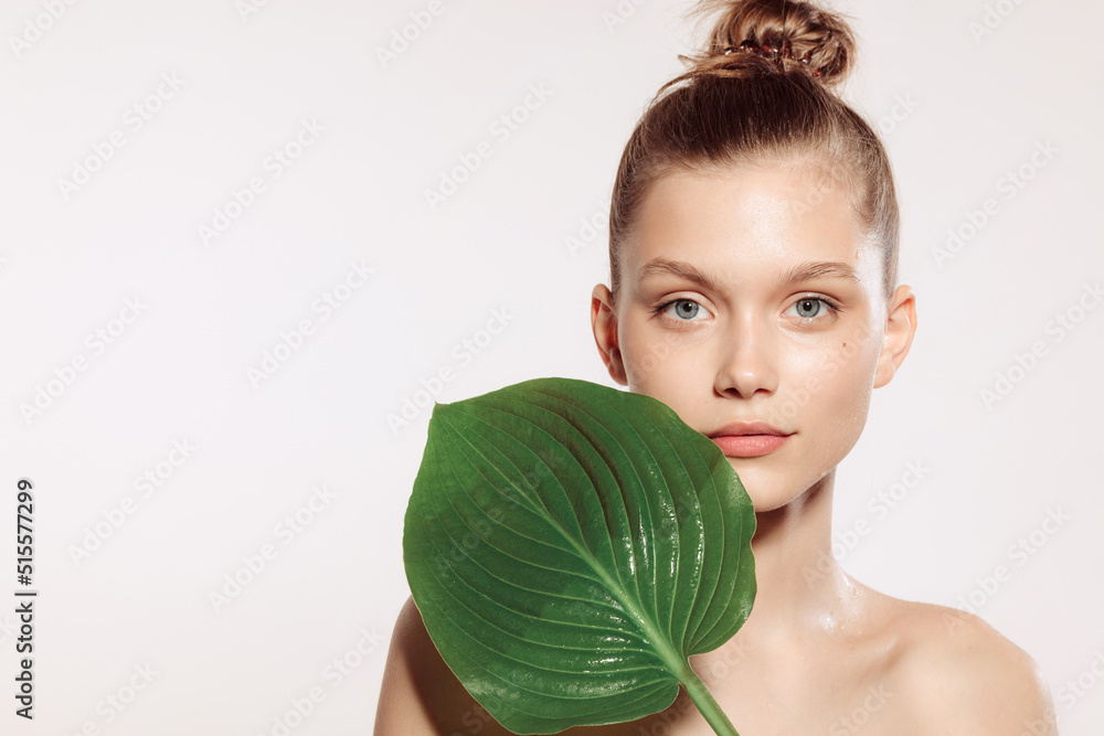 Portrait of young female fashion model without makeup isolated on white ...