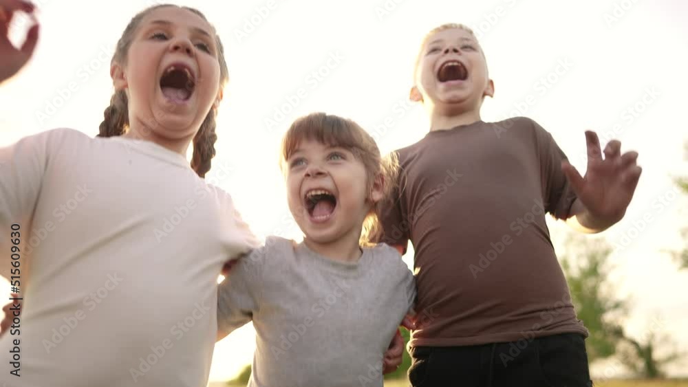 friendly team of children jumping hugging shouting rejoicing in victory ...