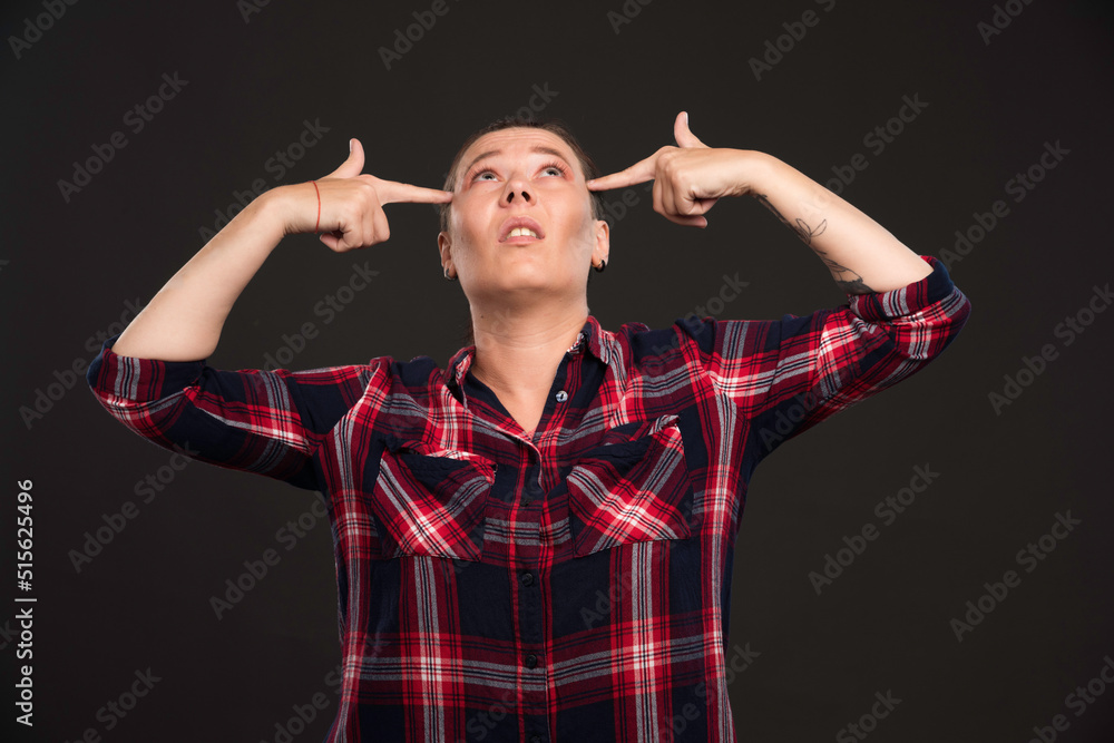Female model in fall winter collection outfits pointing her head and ...