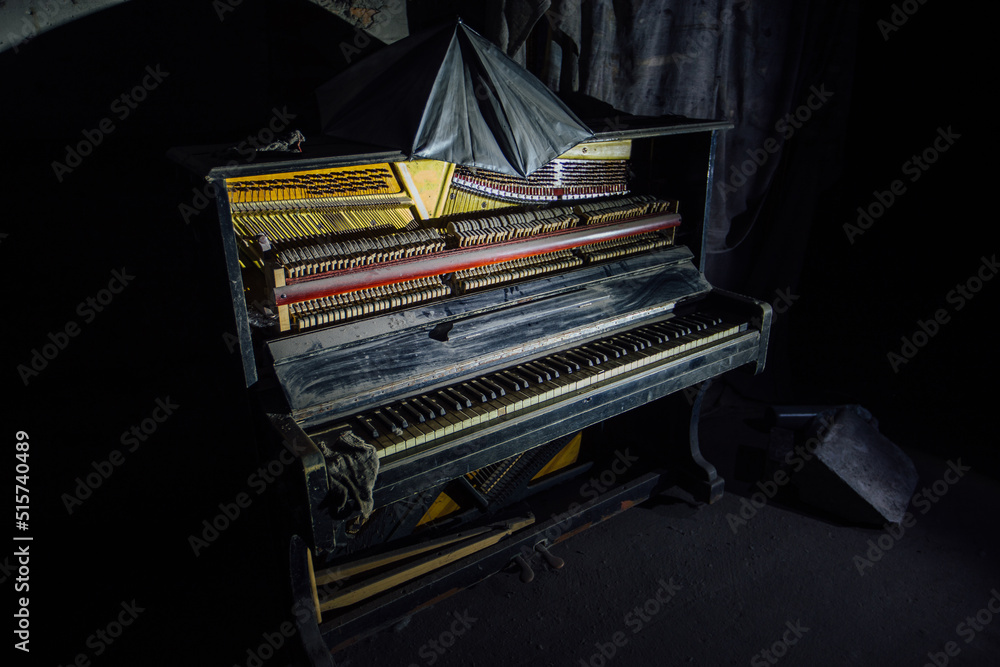 Old broken piano in dark room Stock Photo | Adobe Stock