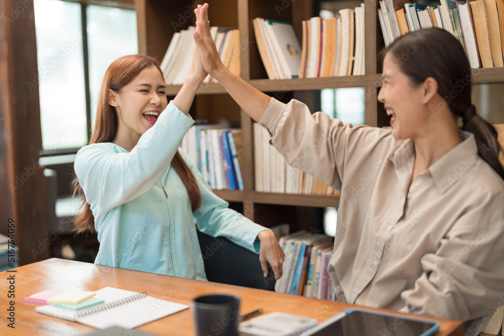 Education concept, Female tutor giving high five to celebrate with ...