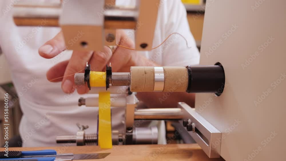 Wideo Stock: Hand making electronic component using coil winding ...