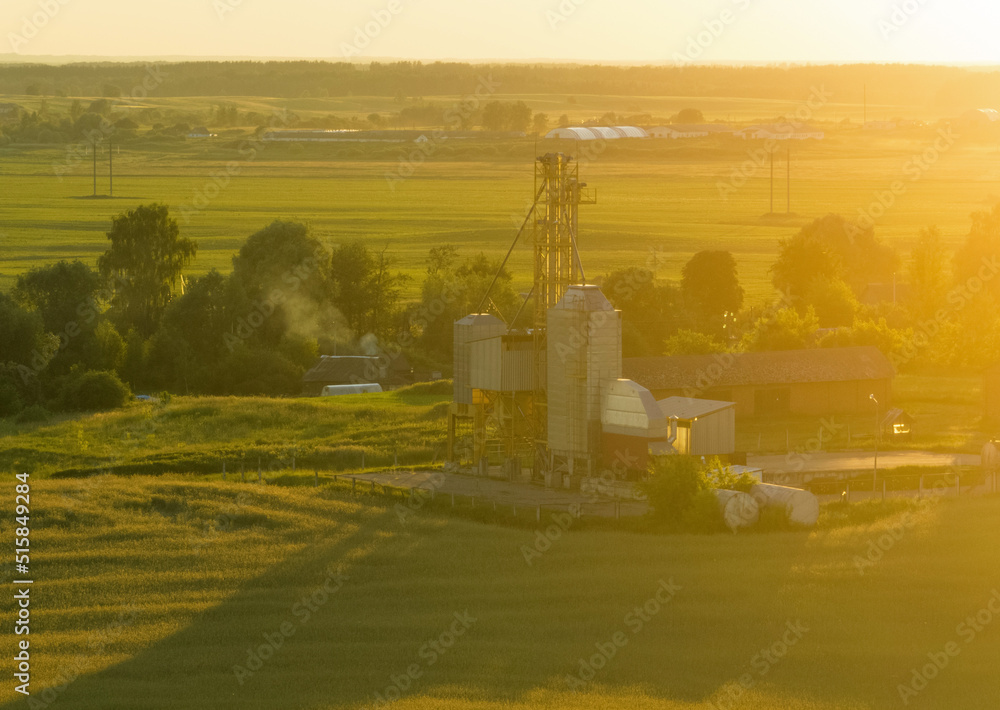 Grain processing plant on sunset. Processing and sifting corn and grain ...