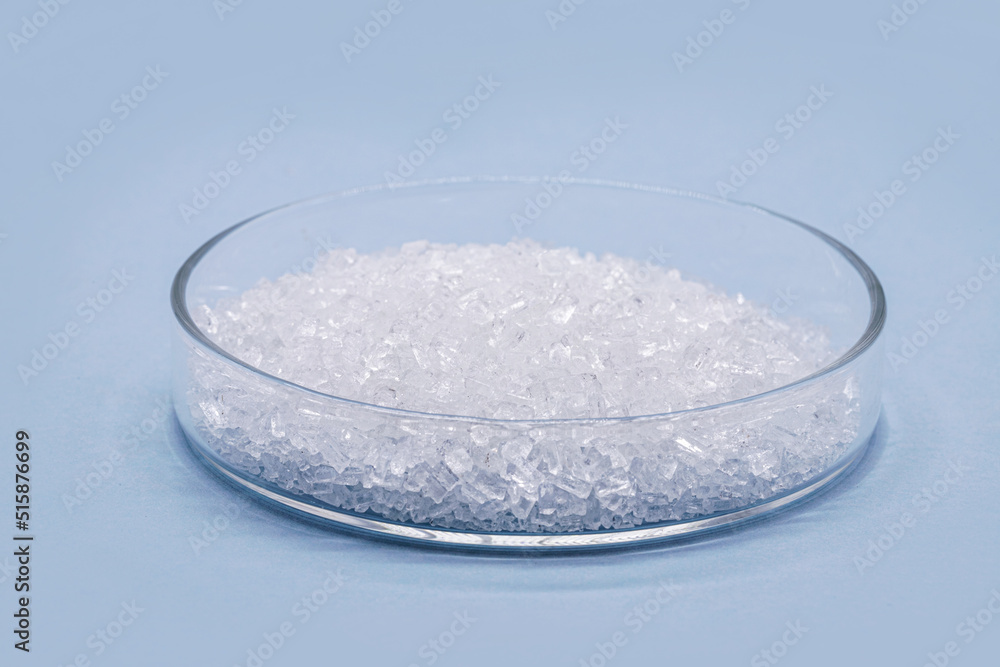 sodium chloride in petri dish, known as salt or table salt, important ...