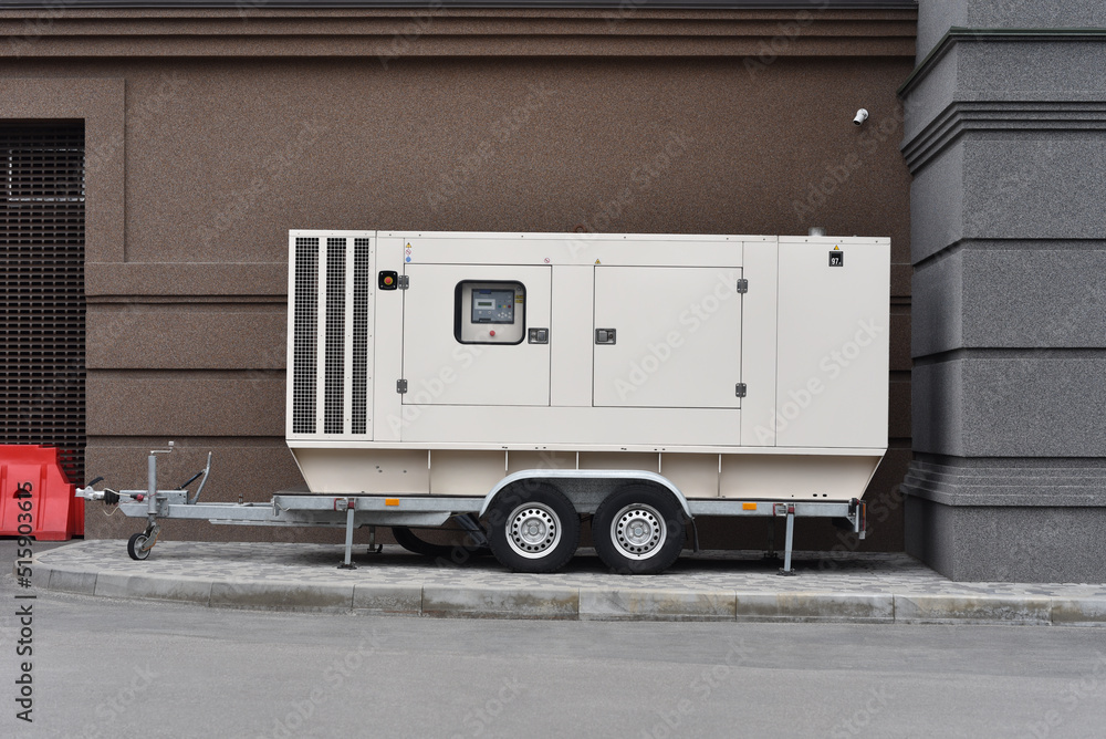 heavy diesel electric generator stand on trailer in yard office ...