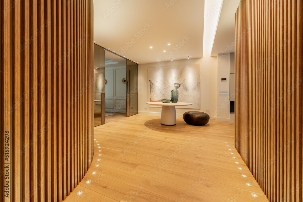 Hallway of a house with walls covered with latticework of vertical ...
