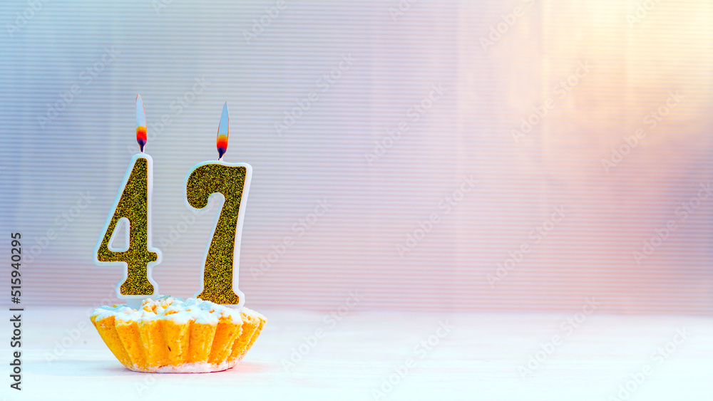 Happy birthday card from candles with the number 47 , golden numbers ...