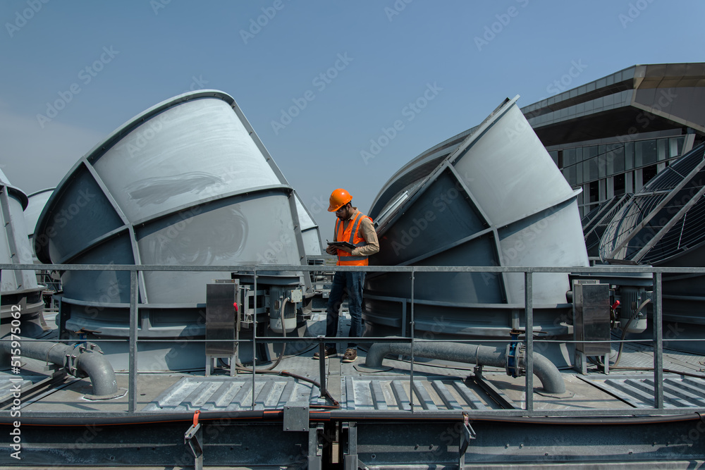 Engineer under checking the industry cooling tower air conditioner is ...