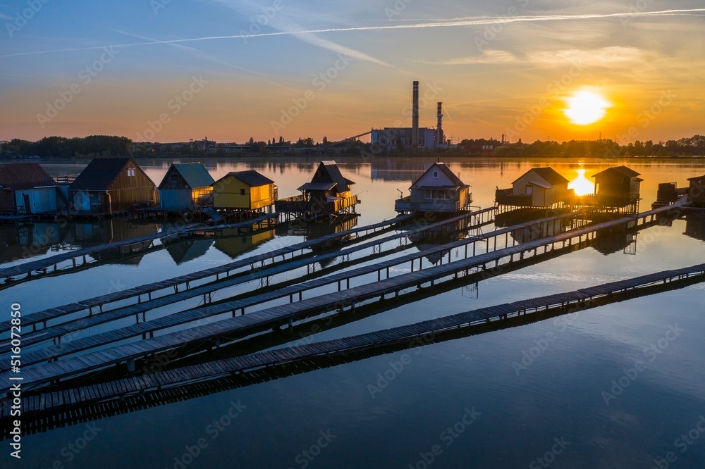 Sunset over the famous tourist attraction: fisherman cabin, floating ...