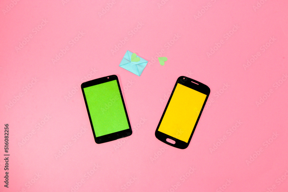 creative idea of sending love messages, two phones with a green and ...