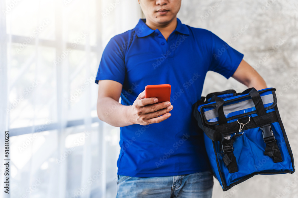 Delivery man browsing address on mobile phone map gps app for fast food ...