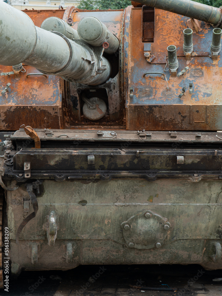 Destroyed Russian self-propelled howitzer. Rusty armor of military ...