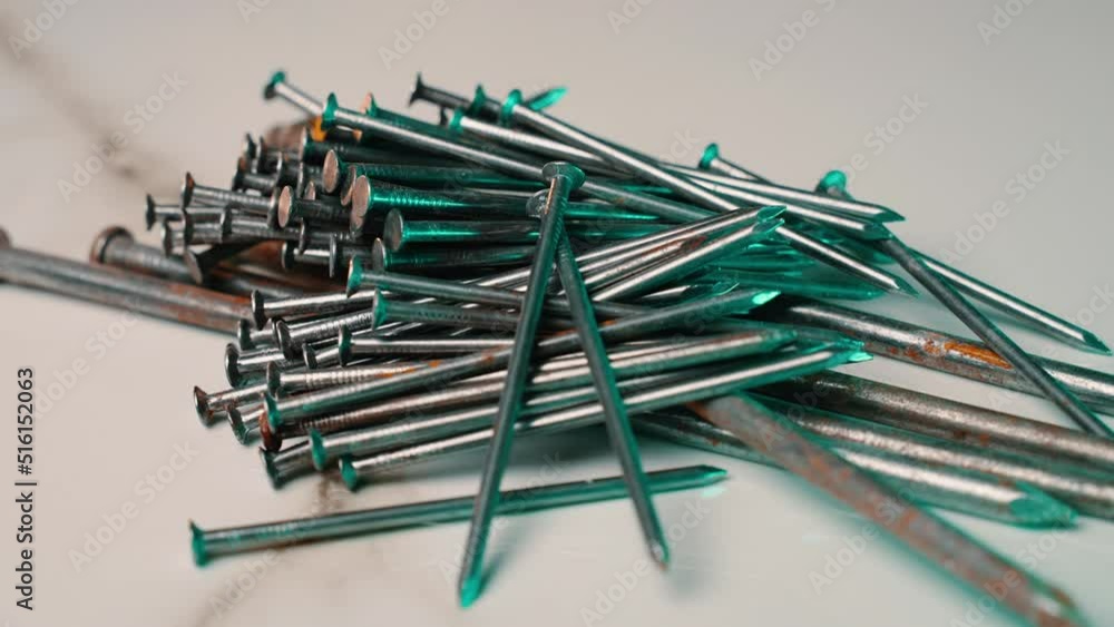 Pile of steel nails of different lengths and thicknesses. Details for ...