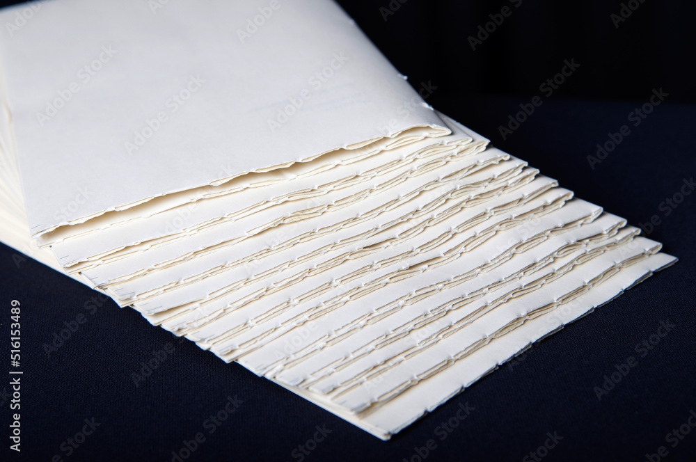 The process of book binding; putting together raw paper folders Stock ...