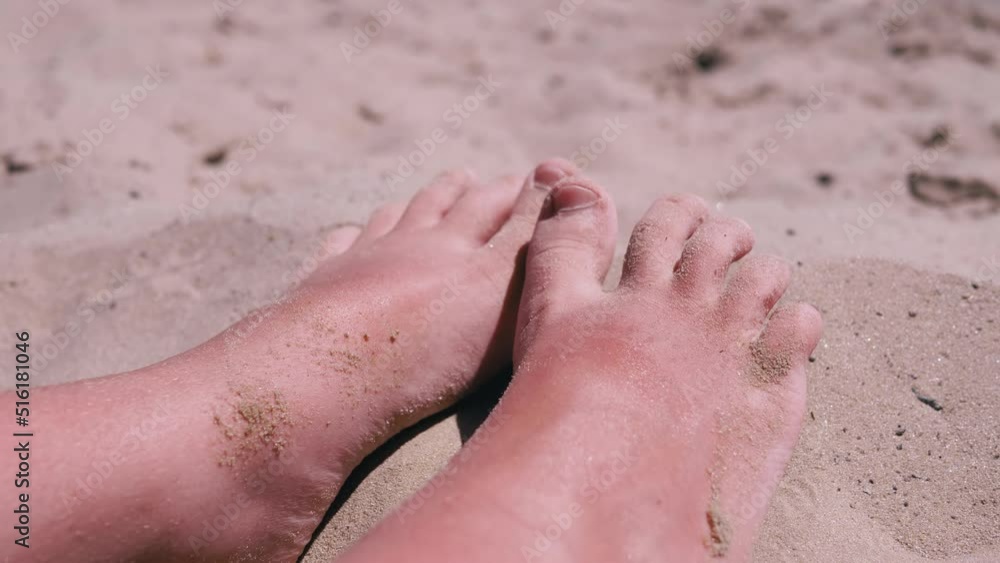 Tanned Red Bare Child Feet on Sand Lies on a Sandy Beach on Seashore ...