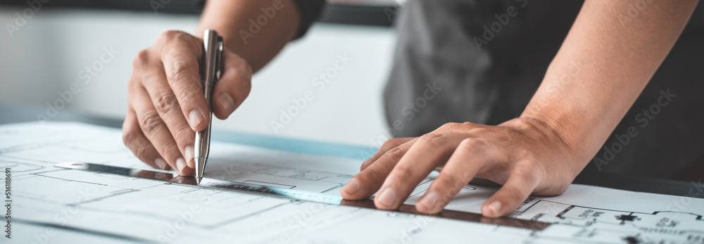 Engineer and Architect concept, Man uses a ruler to measure the floor ...