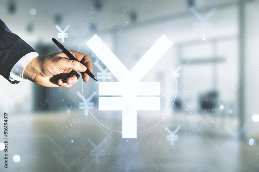Male hand with pen working with abstract virtual Japanese Yen symbol ...