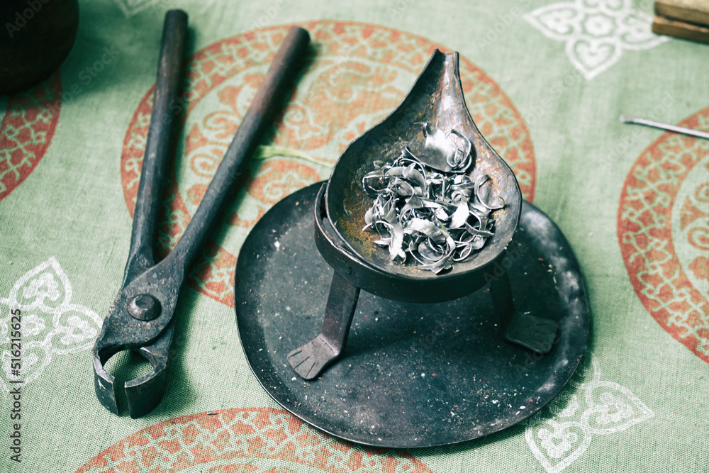 Production of medieval coins by casting and forging. Reconstruction of ...