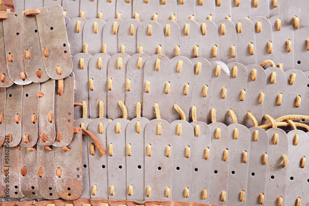 Medieval vintage metal scale armor, background. Reconstruction of the ...
